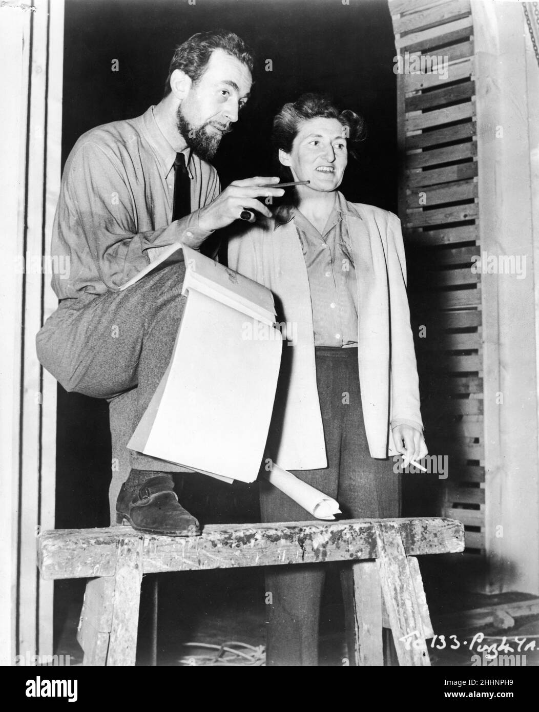 Costume and Set Designer ROGER FURSE and Art Director CARMEN DILLON on set candid during filming ...