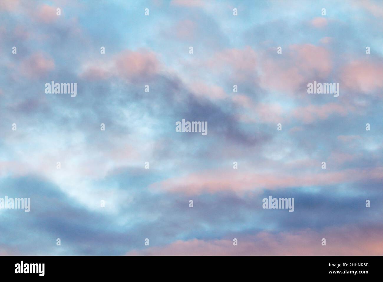 Clouds in the sky are illuminated from below by the light of the sun ...