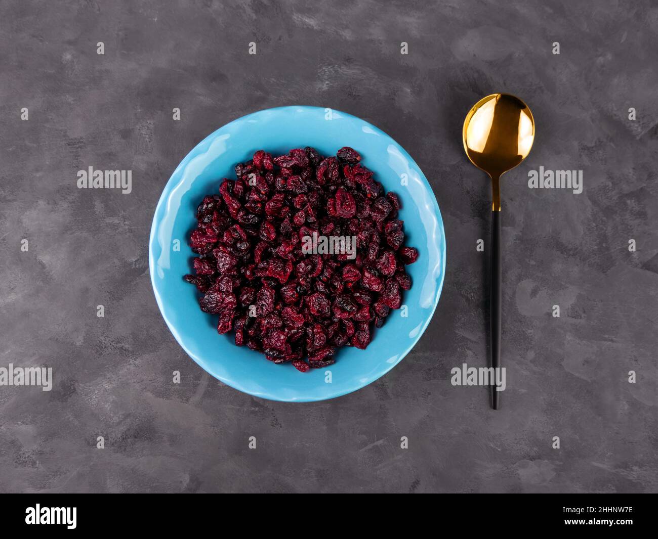 Dried cranberries in blue bowl top view. Healthy tasty dry red berries ...