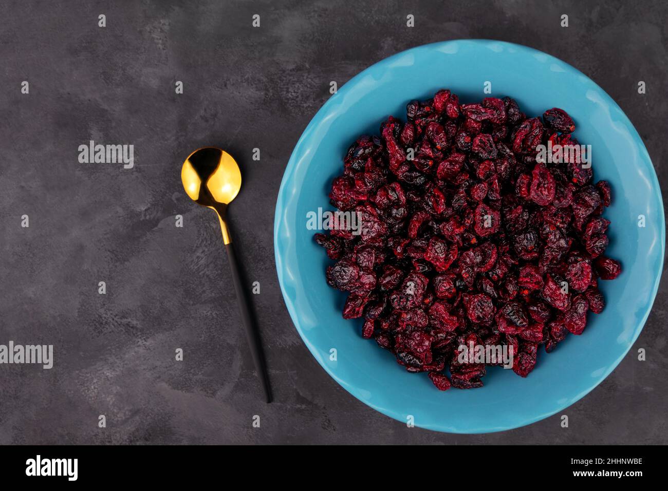 Dried cranberries in blue bowl top view. Healthy tasty dry red berries ...