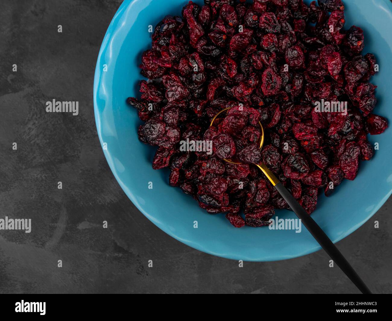Dried cranberries in blue bowl top view. Healthy tasty dry red berries ...