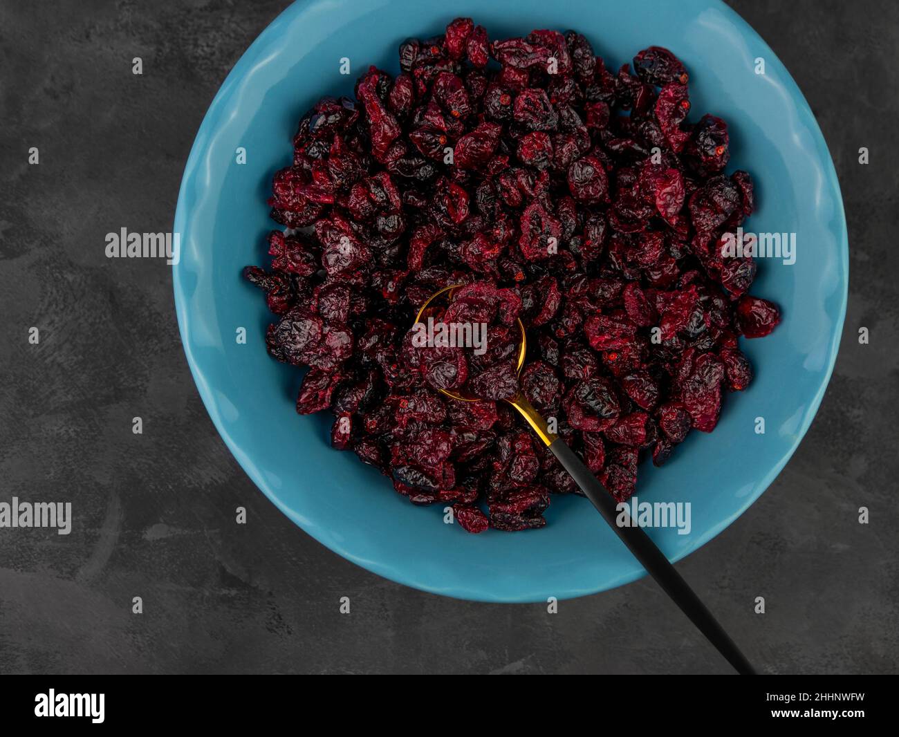 Dried cranberries in blue bowl top view. Healthy tasty dry red berries ...