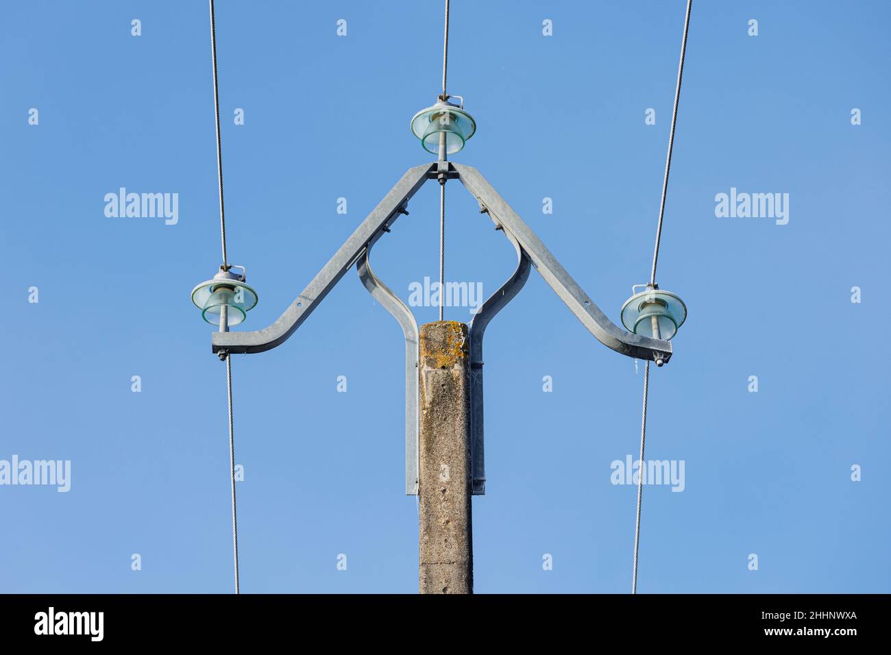 Low angle shot of a wooden three way electricity pole Stock Photo - Alamy