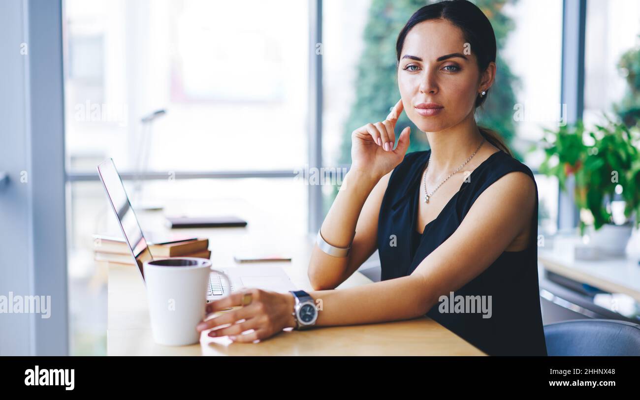 Calm businesswoman working in modern workspace Stock Photo - Alamy