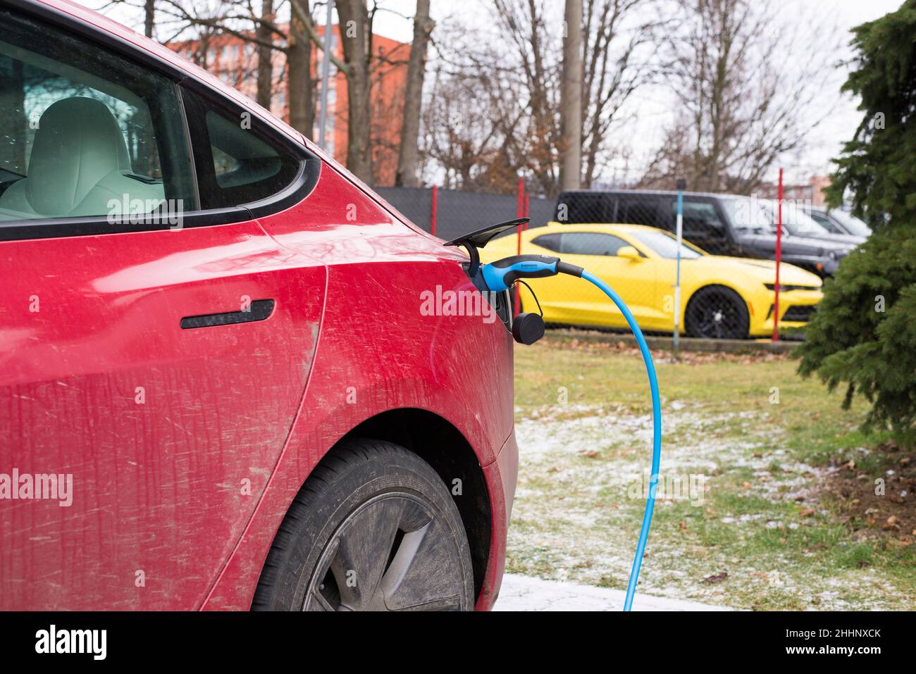 electric cars vs. conventional gas car Stock Photo - Alamy