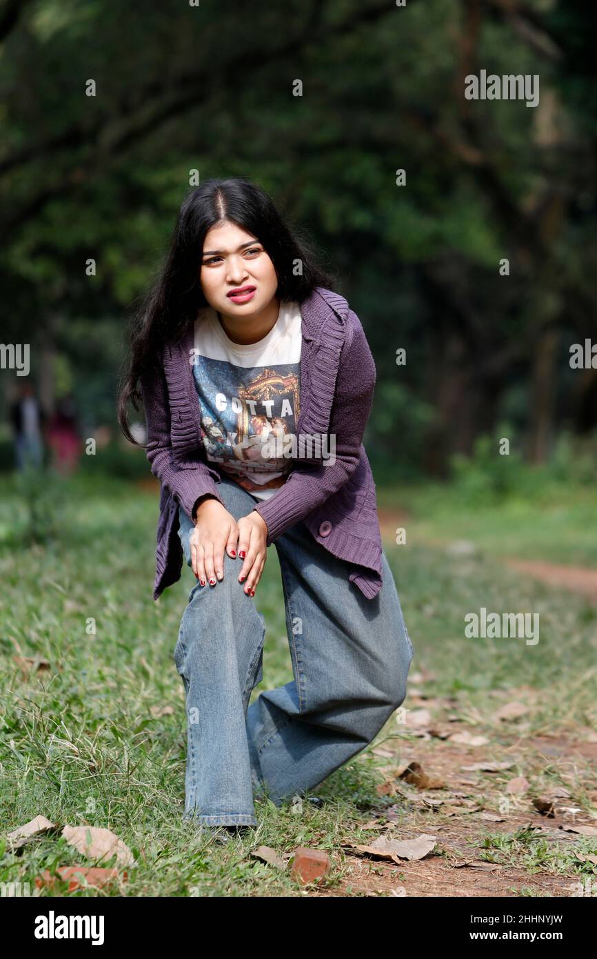 Dhaka, Bangladesh - December 10, 2021: Model Marshia Shawon is showing off her Knee pain, Dhaka ...