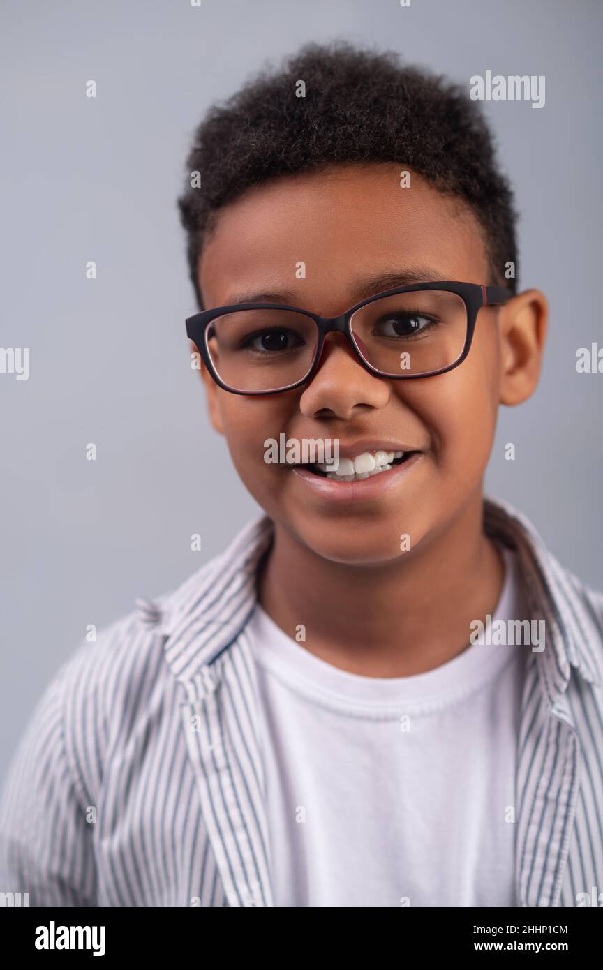 Smiling happy kid in spectacles looking ahead Stock Photo - Alamy
