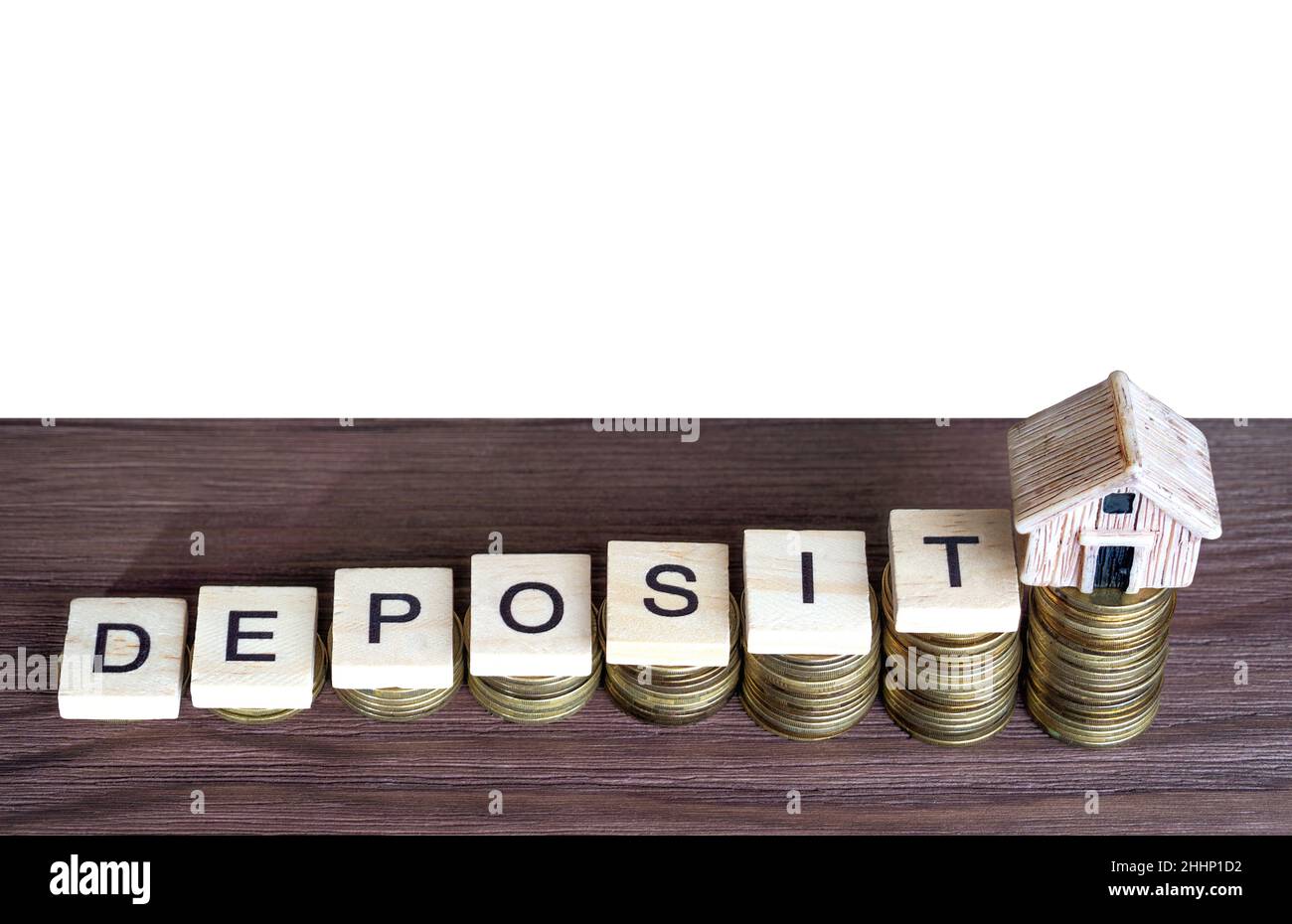 Word DEPOSIT made from wooden letter blocks and a miniature house ...