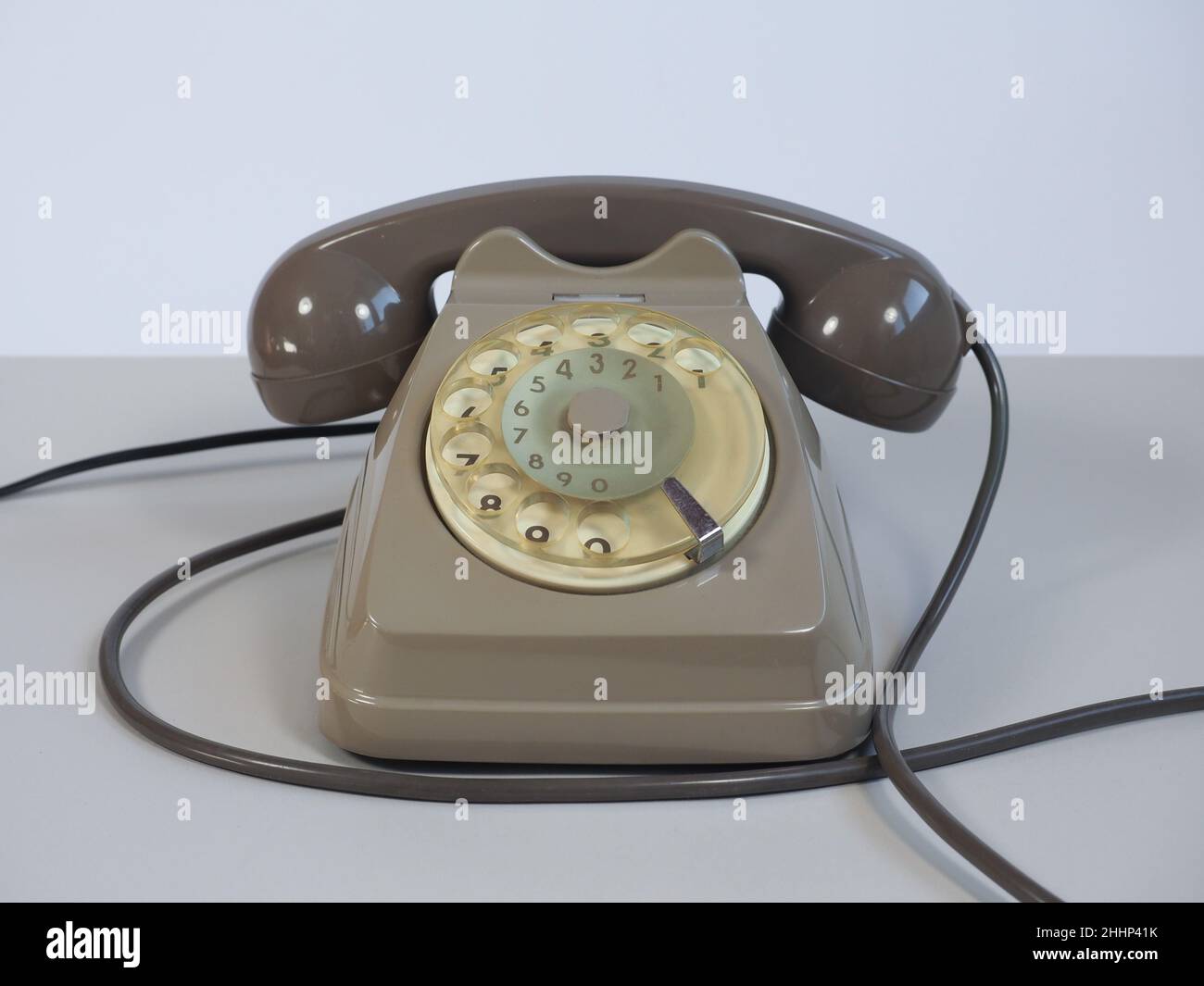 Vintage grey rotary dial analog landline telephone Stock Photo - Alamy