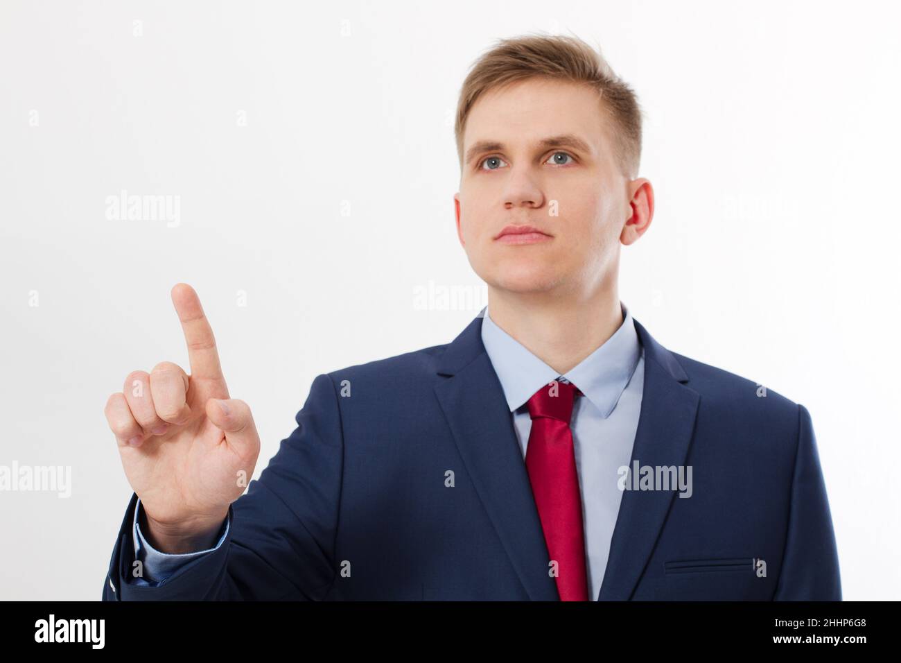 Stylish Business man point on virtual screen isolated on white ...