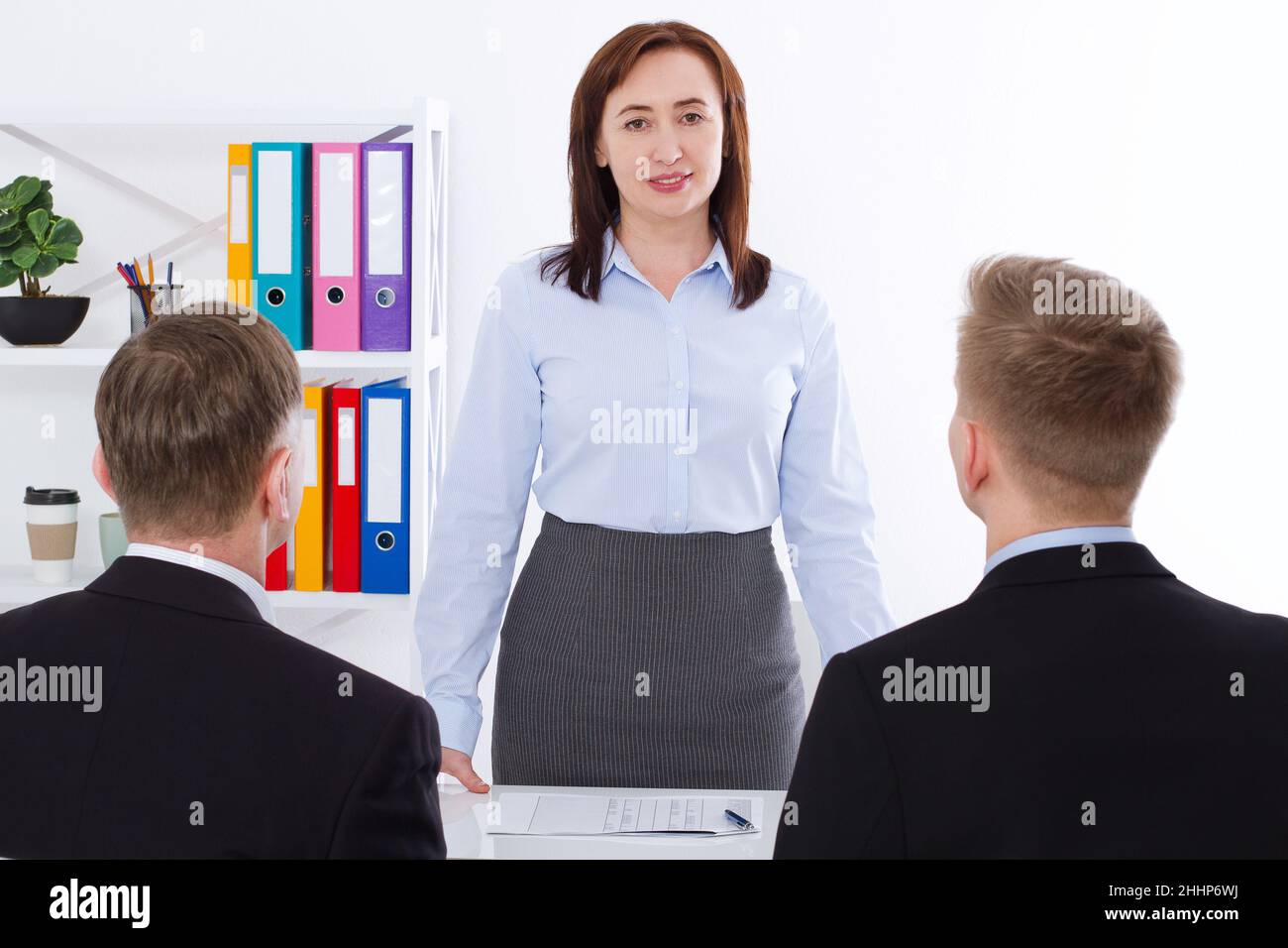 Serious Woman is a boss. Business meeting at office background. Team ...