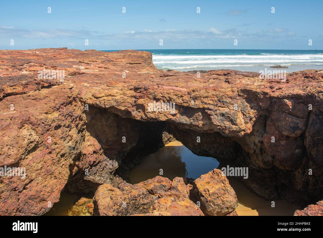 View of the spectacular Forrest Caves at low tide on Surf Beach ...
