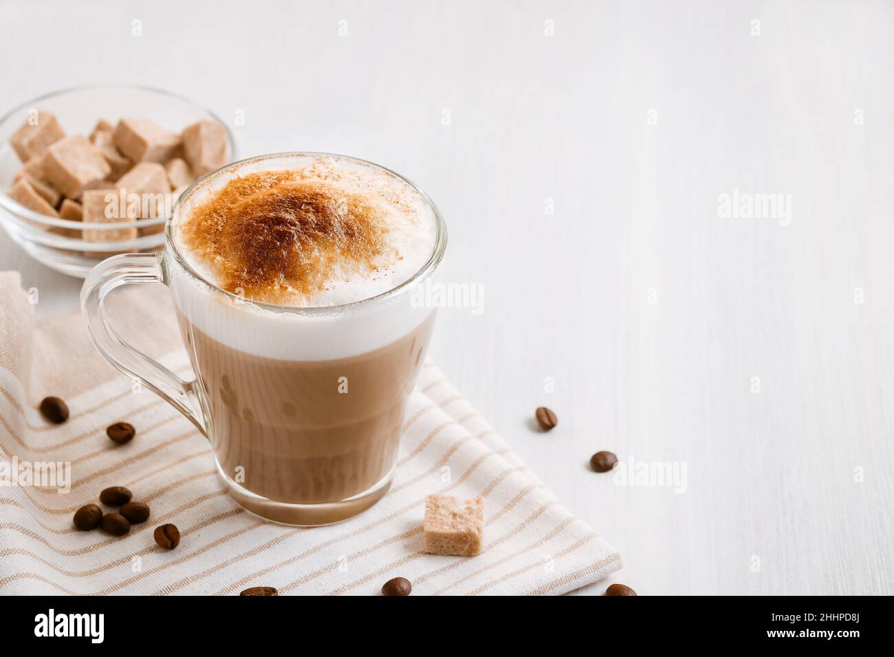 Latte coffee poured in layers with froth and a crispy chocolate top on ...