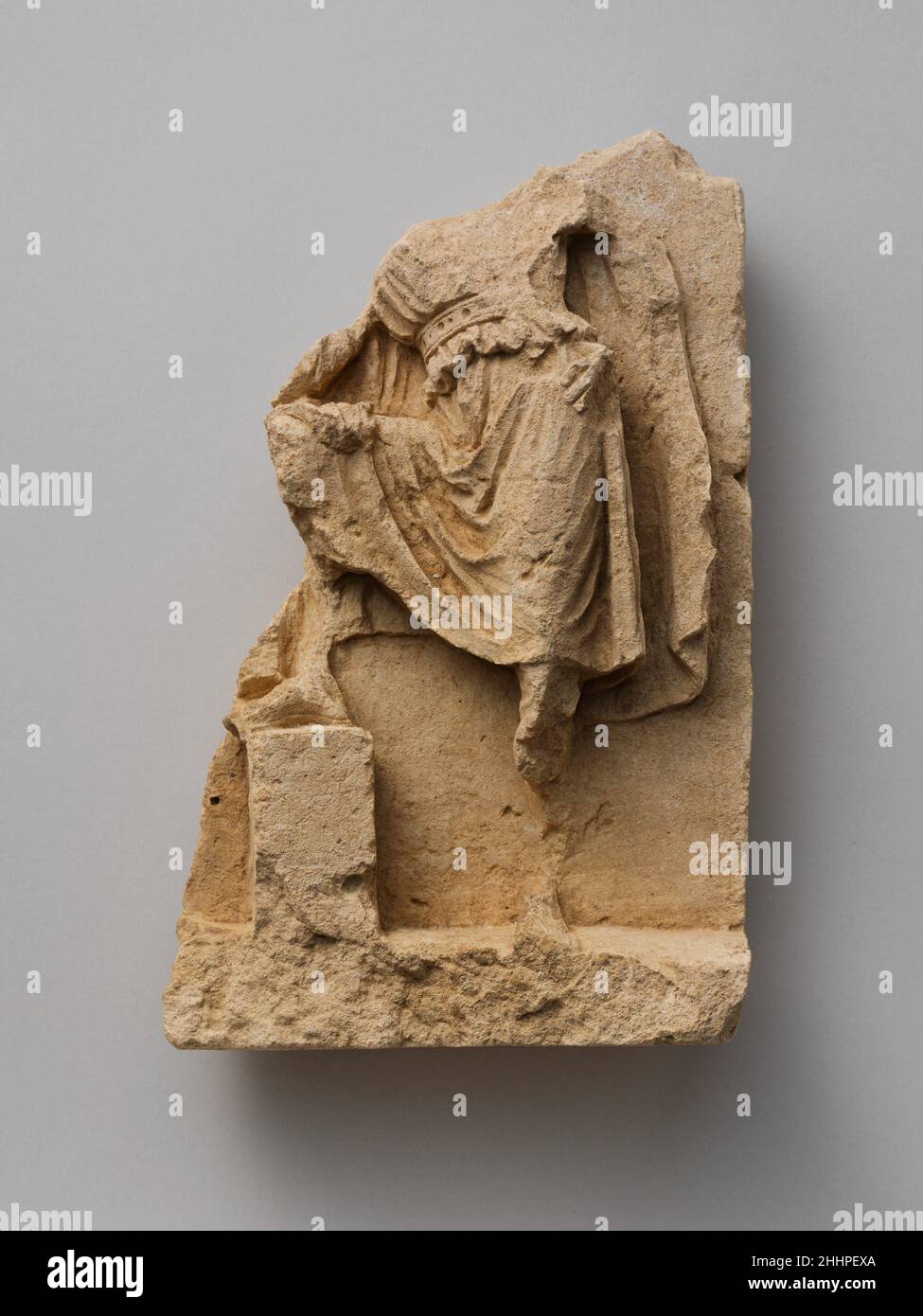 Fragment of a limestone relief with standing figure 4th–3rd century B.C ...