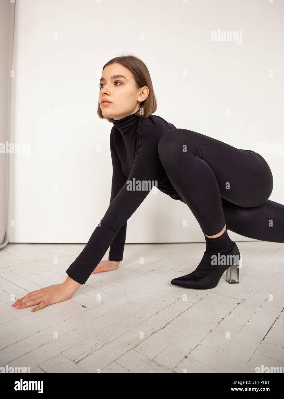 Crawling like a cat woman with square hair and white skin totally in ...