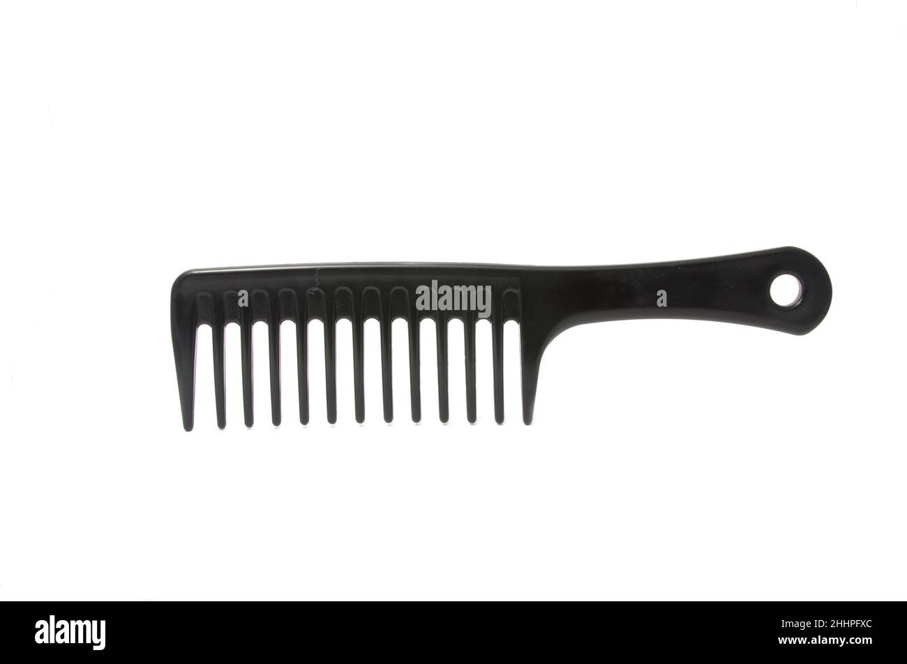Black plastic comb isolated on the white Stock Photo - Alamy