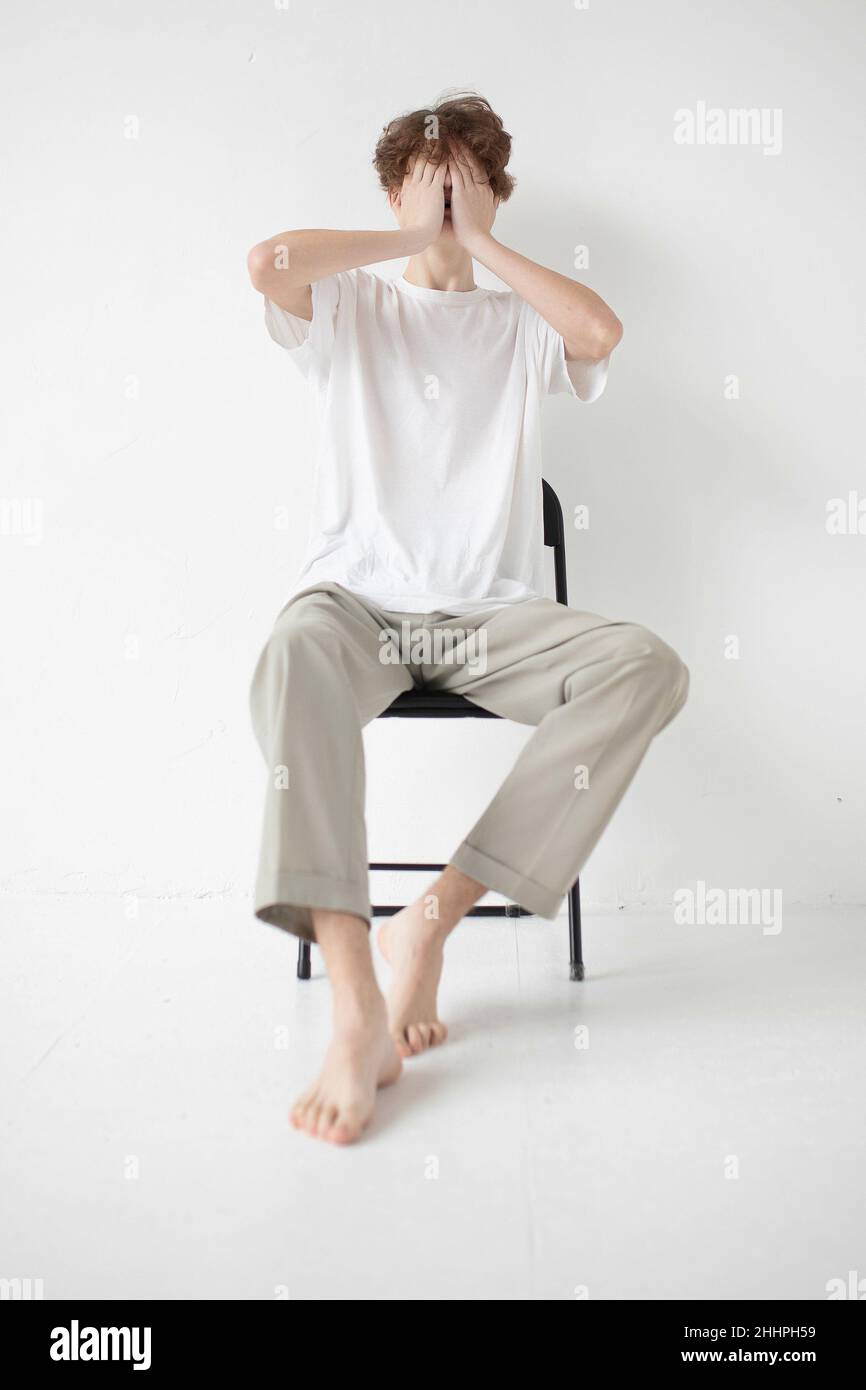 Barefoot attractive young european man isolated on light grey covered ...