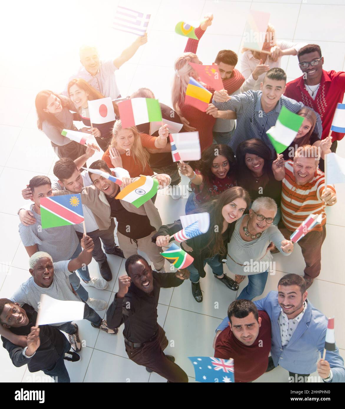 Top view international friends standing together with flags Stock Photo ...