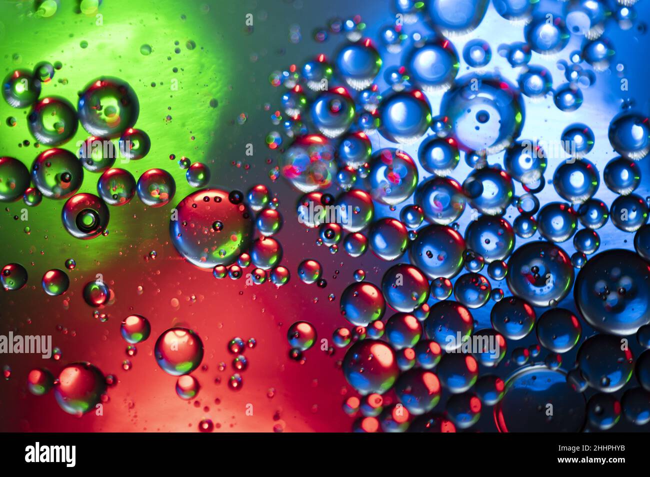 Macro shot of floating oil and liquid colorful bubbles Stock Photo - Alamy