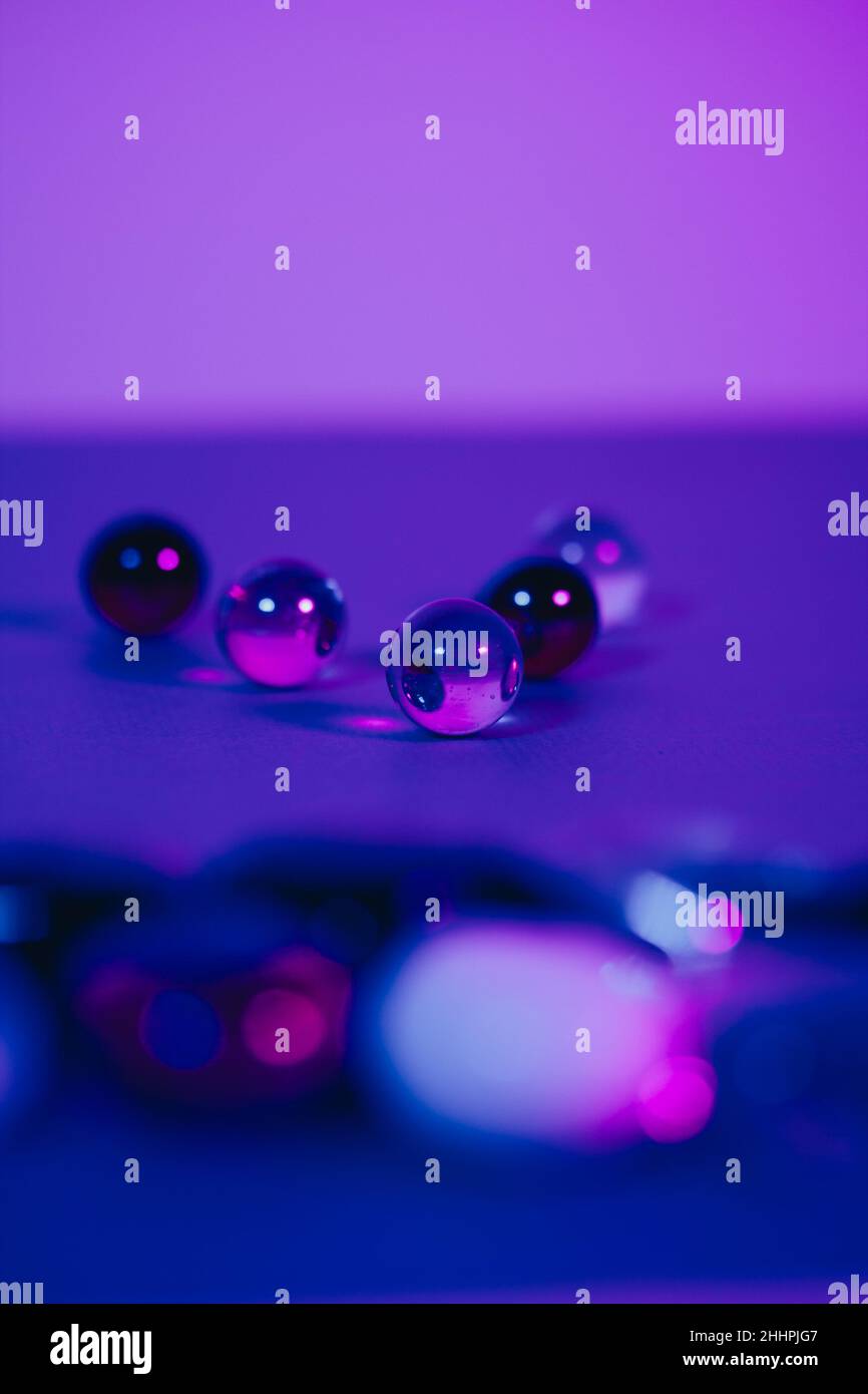 Transparent and colored glass balls in the shape of a triangle are ...