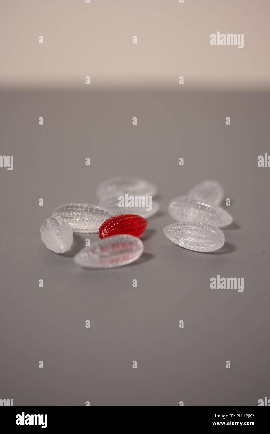 Clear and colored glass crystals are scattered on the table. Close-up ...