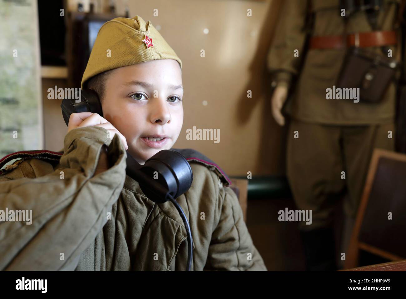 Portrait of child in uniform of red army with telephone receiver Stock ...