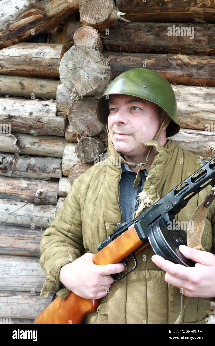 Portrait of man posing with PPSh-41 submachine gun Stock Photo - Alamy