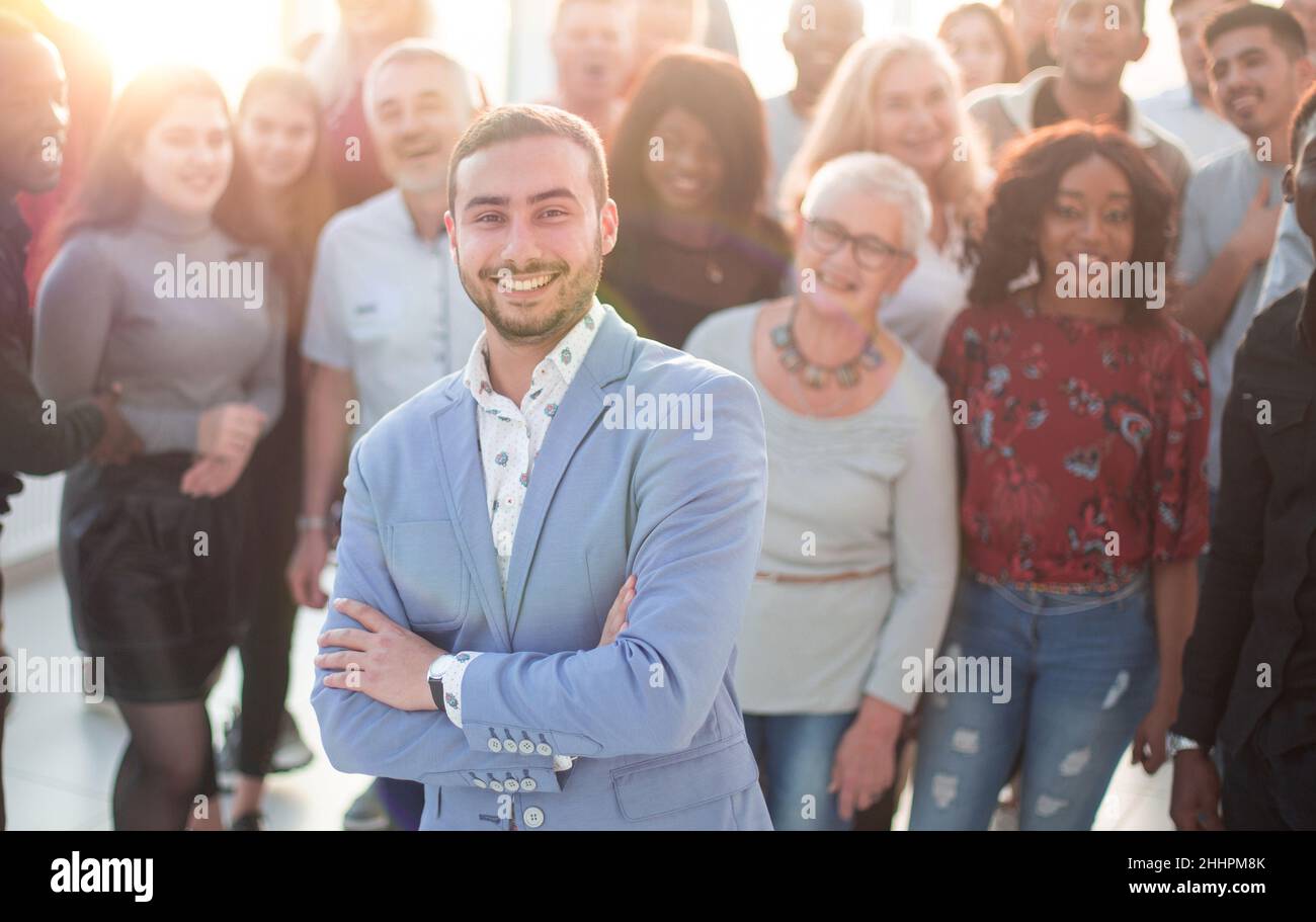 confident young man and his associates standing together Stock Photo ...