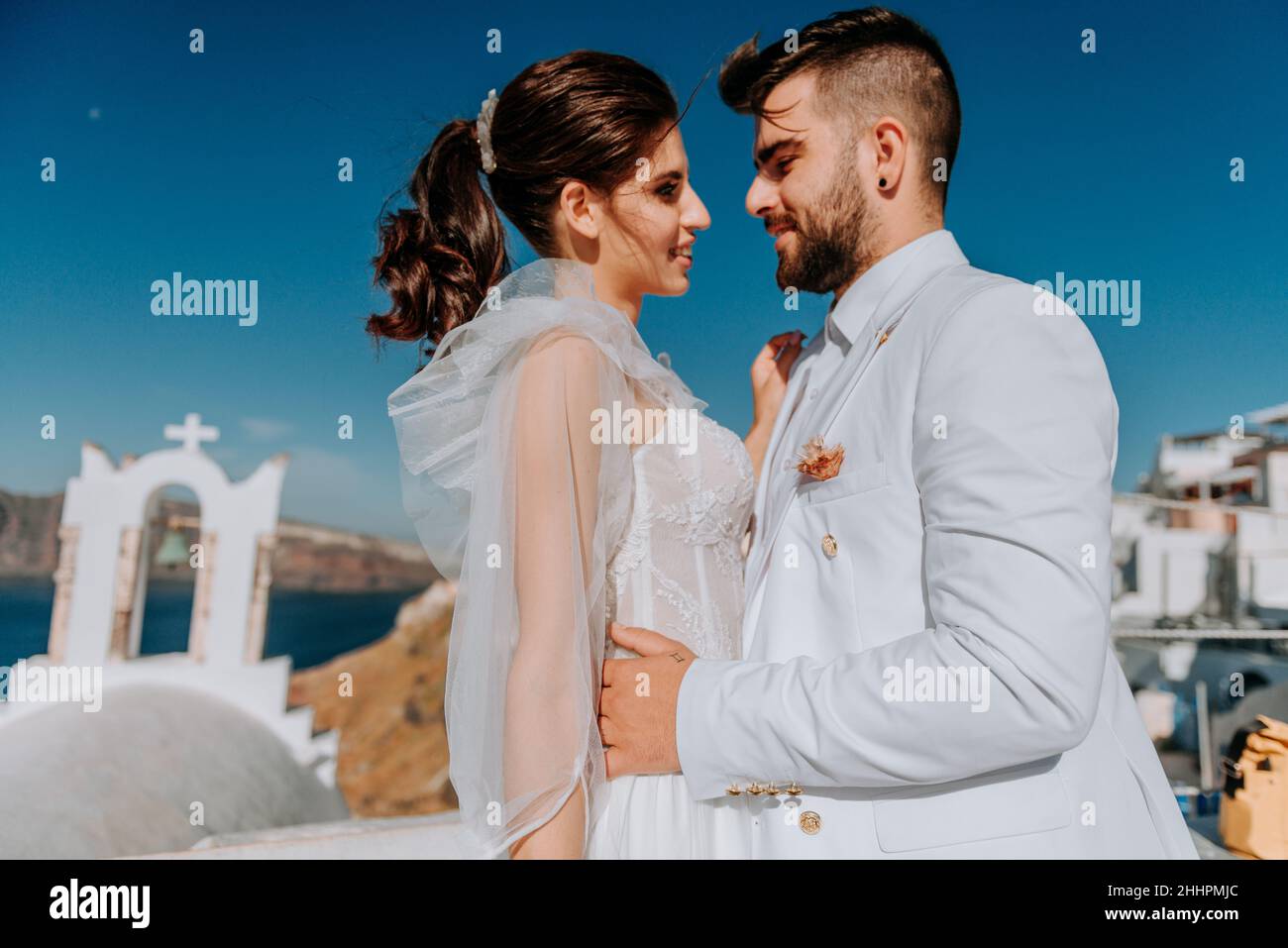 beautiful bride and groom in their summer wedding day on greek island ...