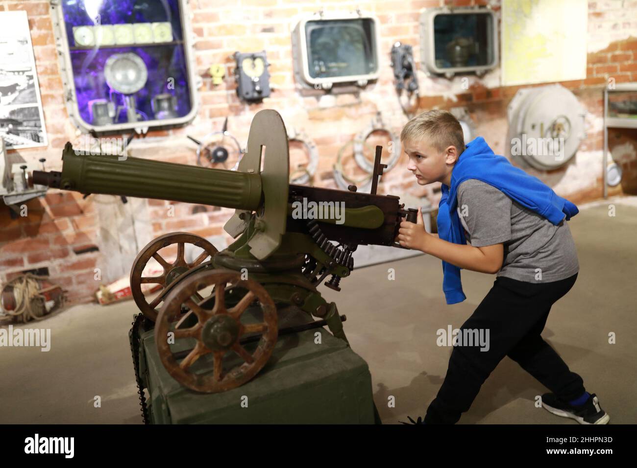 Portrait of child with machine gun maxim Stock Photo - Alamy
