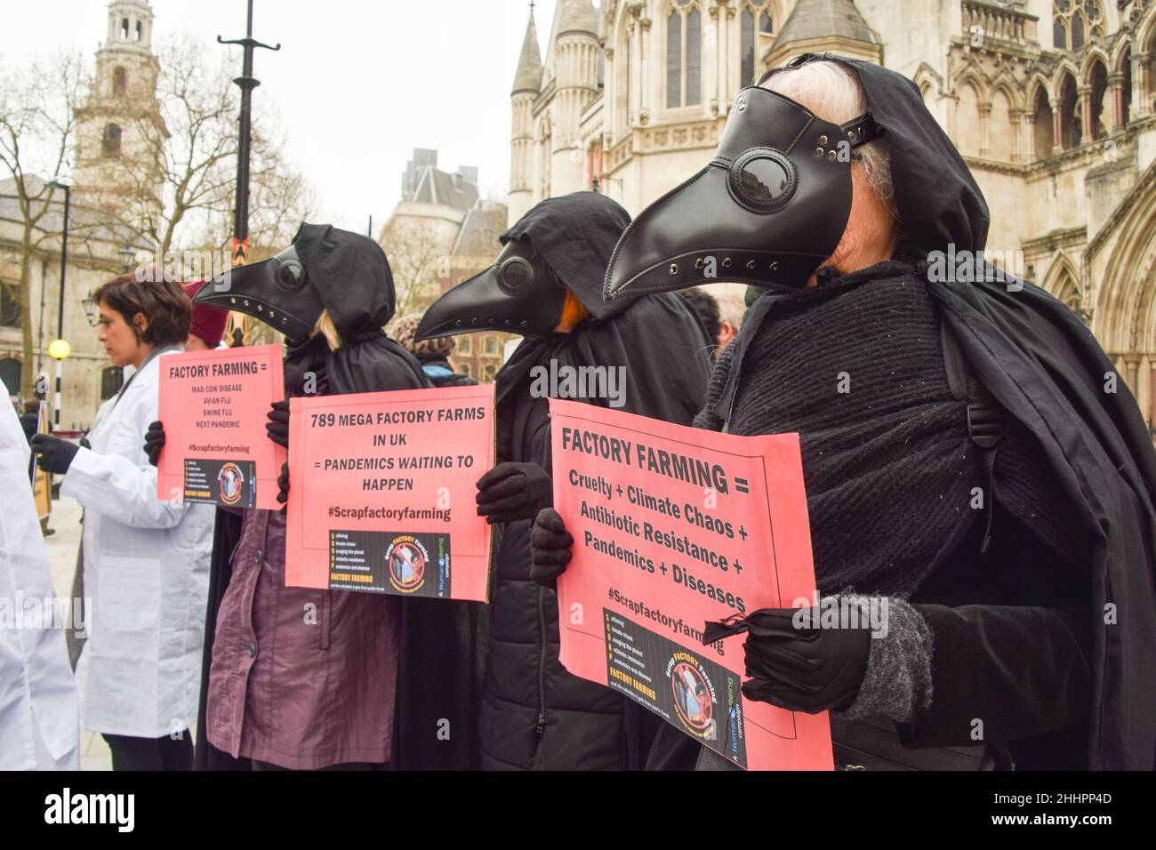 London, UK. 25th Jan, 2022. Activists wearing costumes hold anti ...