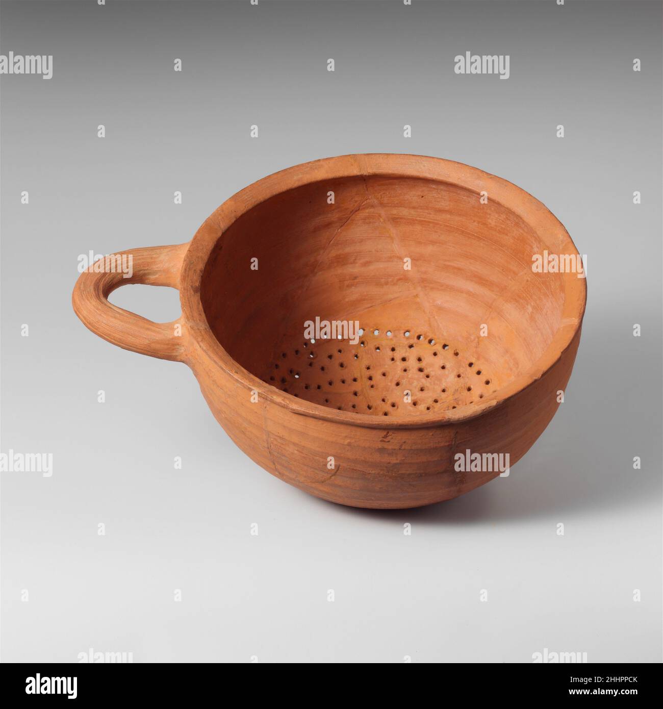 Terracotta hemispherical strainer 6th century B.C. Lydian This bowl ...