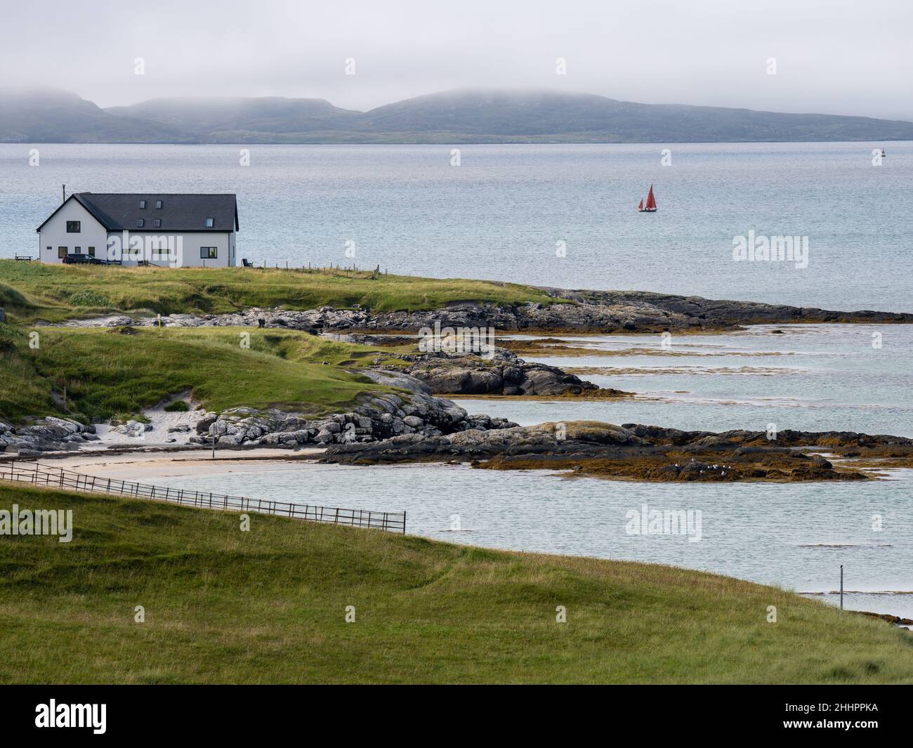 View towards a residential house on Eriskay Beach near the coastal ...