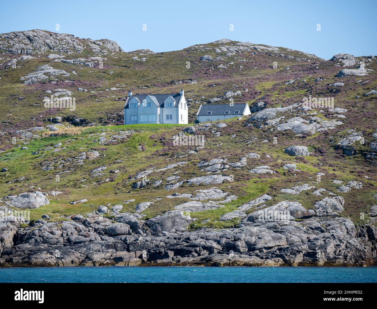 View towards a residential house near Eriskay Ferry Terminal Stock ...