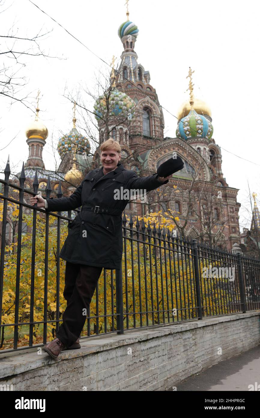 The happy man posing on the church background, st. Petersburg Stock ...