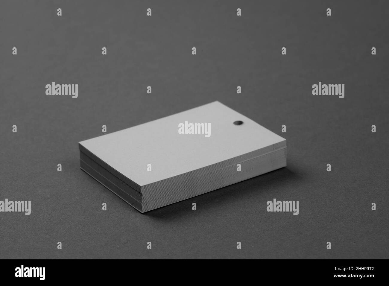 Bunch of cardboard white label tags for items with little hole in top ...