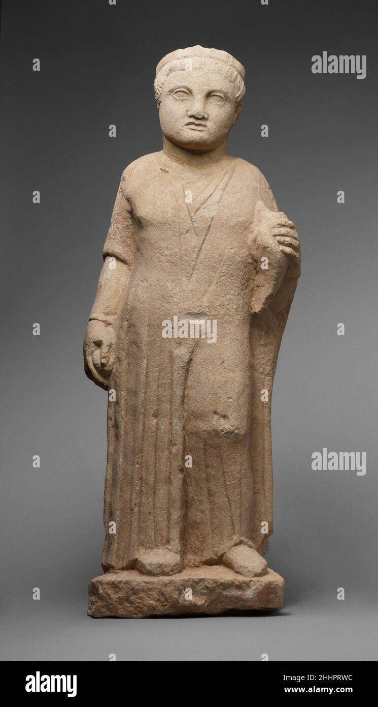 Limestone statue of a male votary holding a dove and an apple 3rd–1st ...