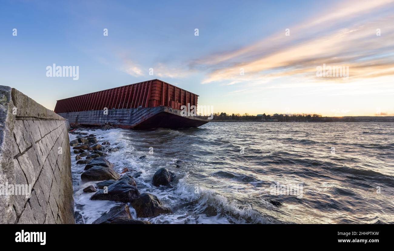 Barge container ship collided on a rocky coast during wind storm ...