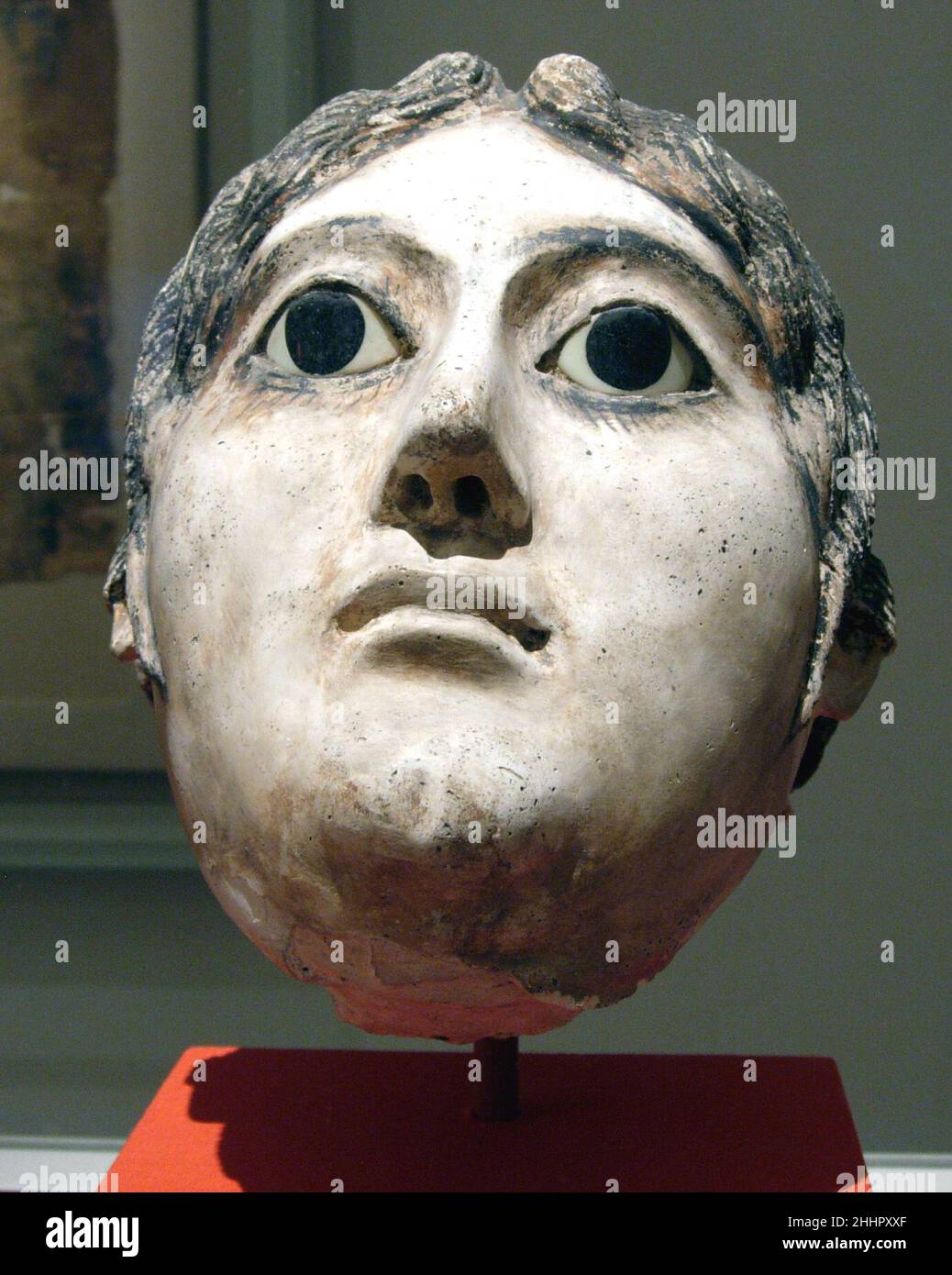 Mask of a woman with a large coil of plaited hair A.D. 117–138 Roman ...