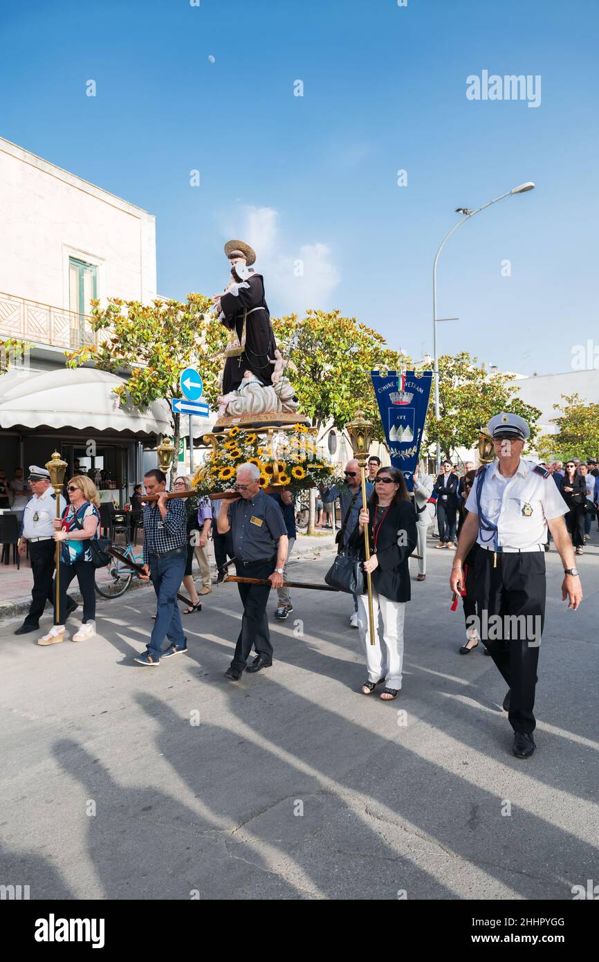 The men carry the statue of Saint Anthony, patron saint of the city ...