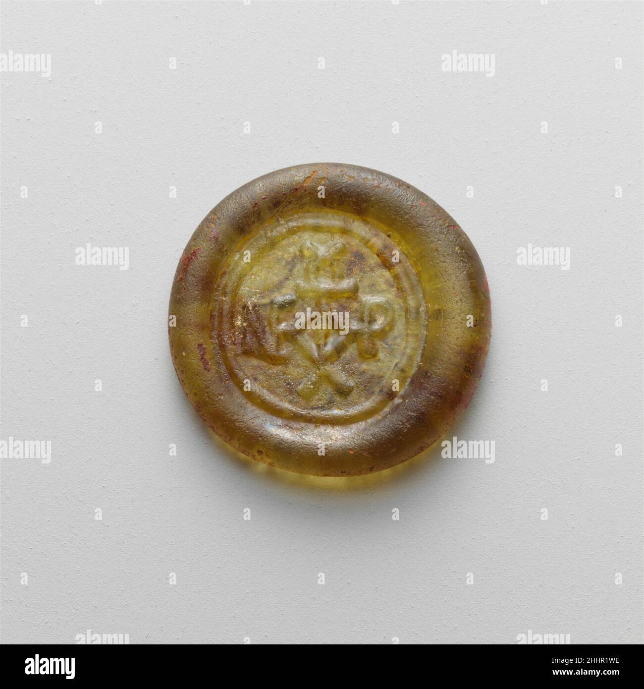 Glass weight 6th–early 7th century A.D. Roman Translucent pale yellow ...