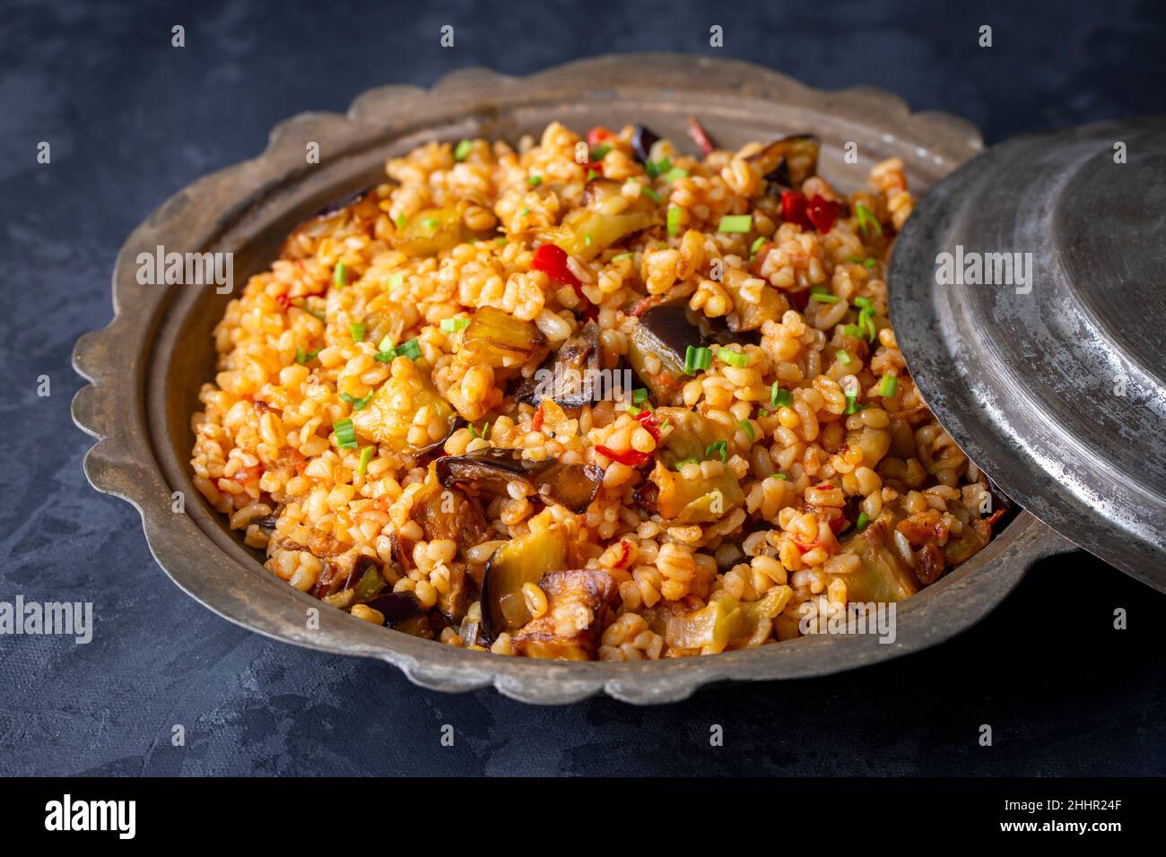 Traditional delicious Turkish food; Bulgur pilaf with eggplant and ...