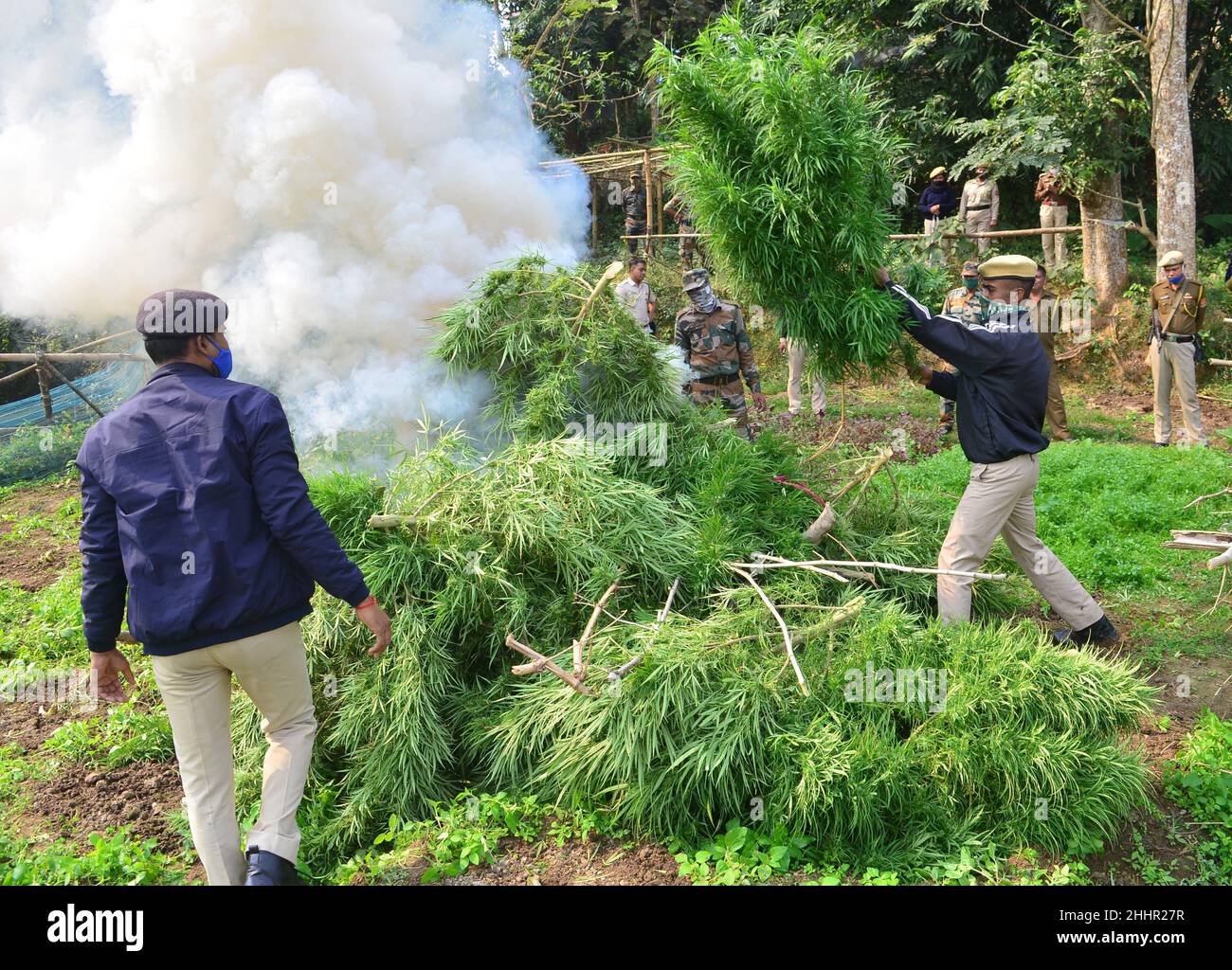 Police and TSR (Tripura State Rifles) personnel are destroying ...