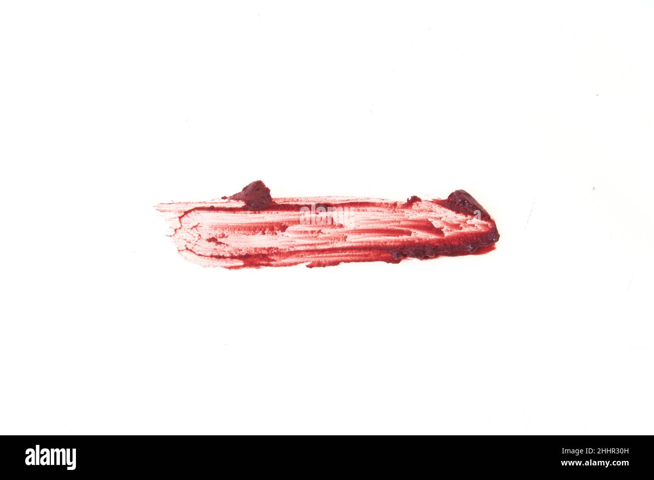 The smear and texture of lipstick. The pink color is highlighted on an ...