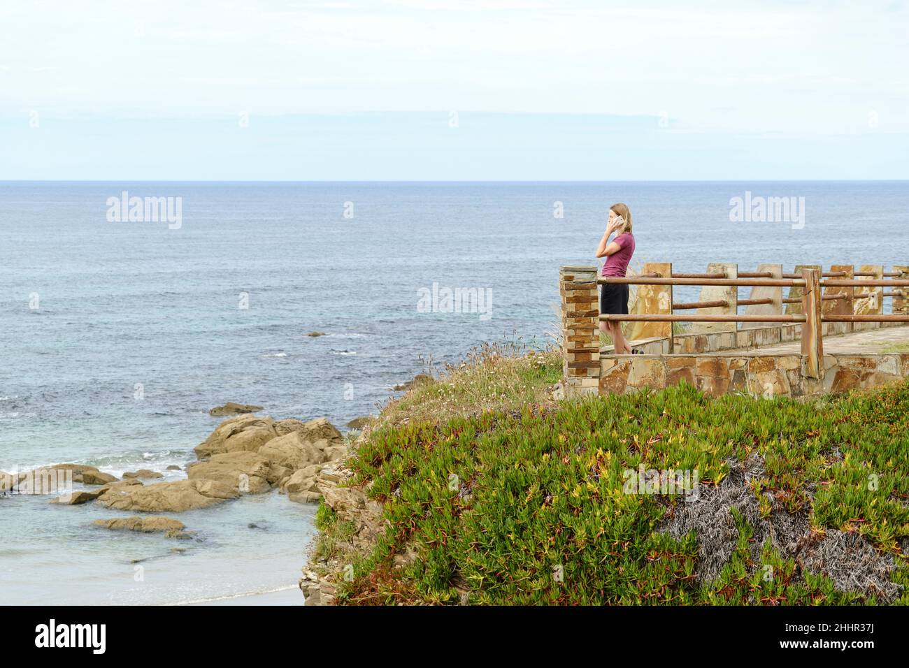 Mature woman answering a phone call on vacation Stock Photo - Alamy
