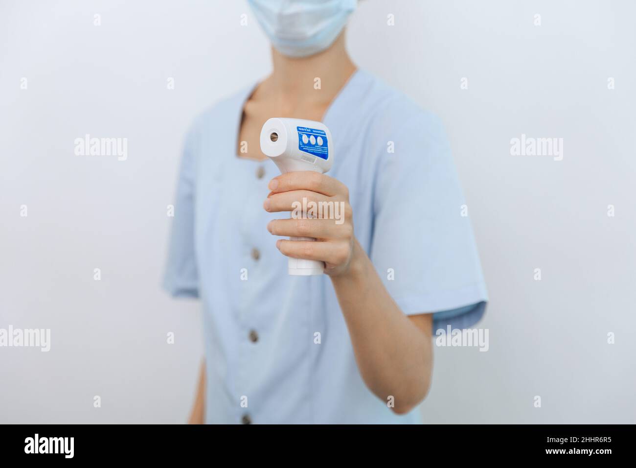 Temperature measurement gun in doctor hands. Close-up shot of doctor ...