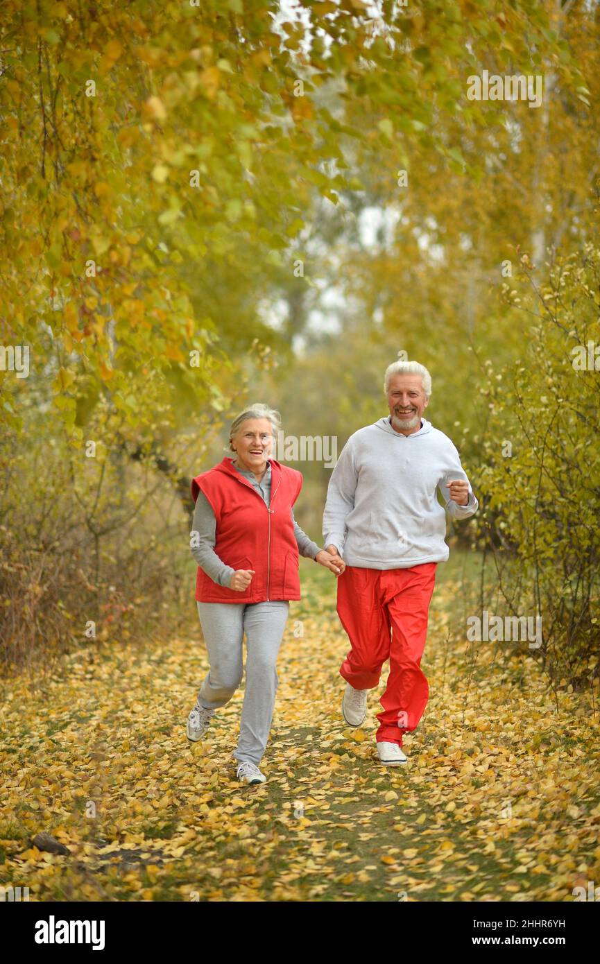 Elderly people running in the park hi-res stock photography and images ...