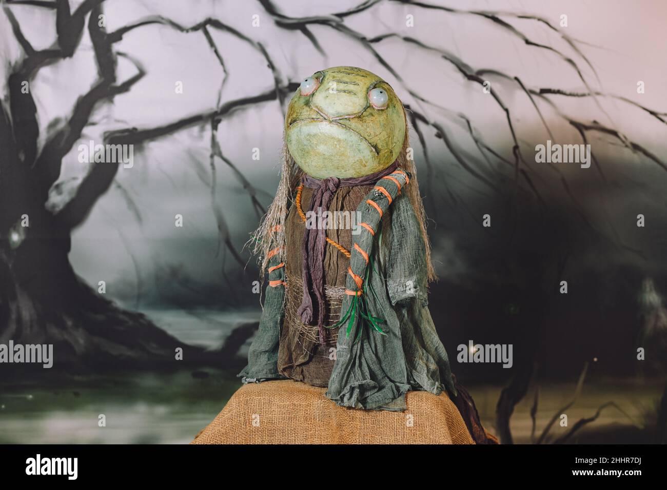 Closeup of a modeled water goblin against an illustrated background ...