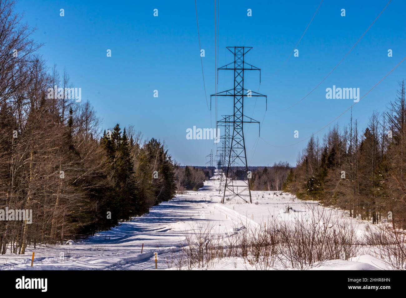 Snowmobile tracks through the power lines Stock Photo - Alamy