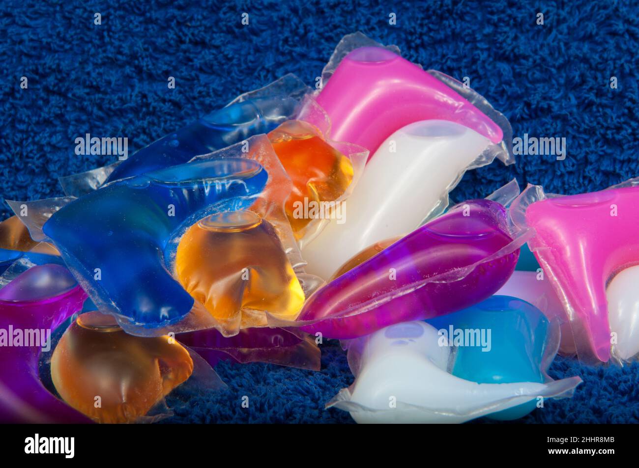 Washing color gel capsule on the blue cloth texture Stock Photo - Alamy